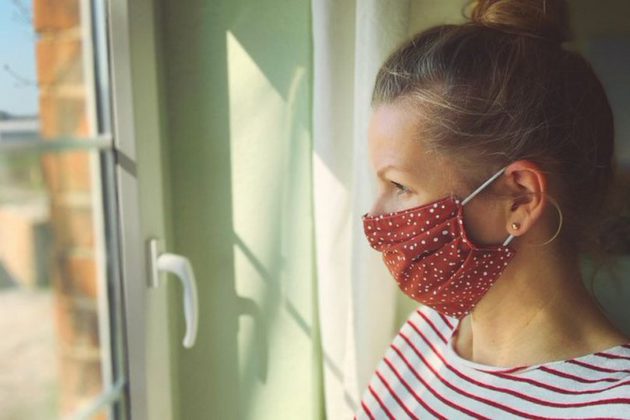 Check out photo of couple kissing through mask to prevent infection ...