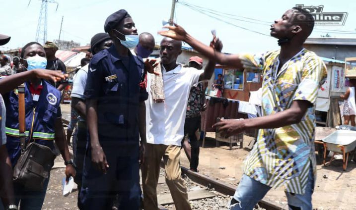 Photo of the week: Squatter threatens to beat police officer ...