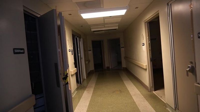 Explorer films inside abandoned hospital with blood-stained autopsy ...