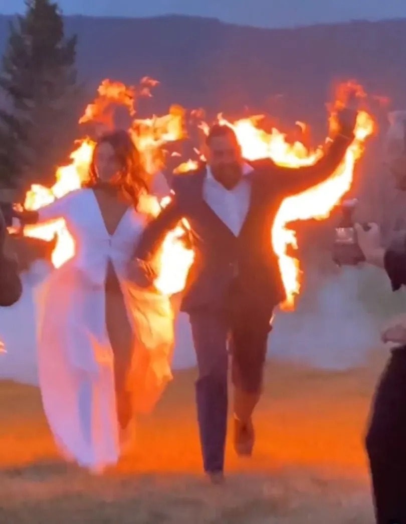 Moment bride and groom set themselves on fire at their wedding [Video ...